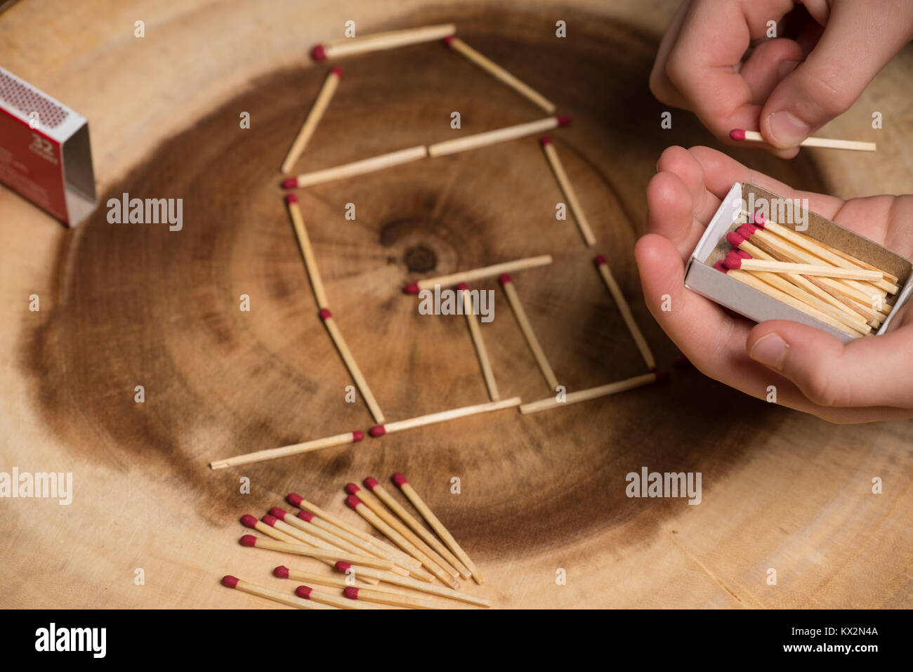 Child playing with matches Stock Photo - Alamy