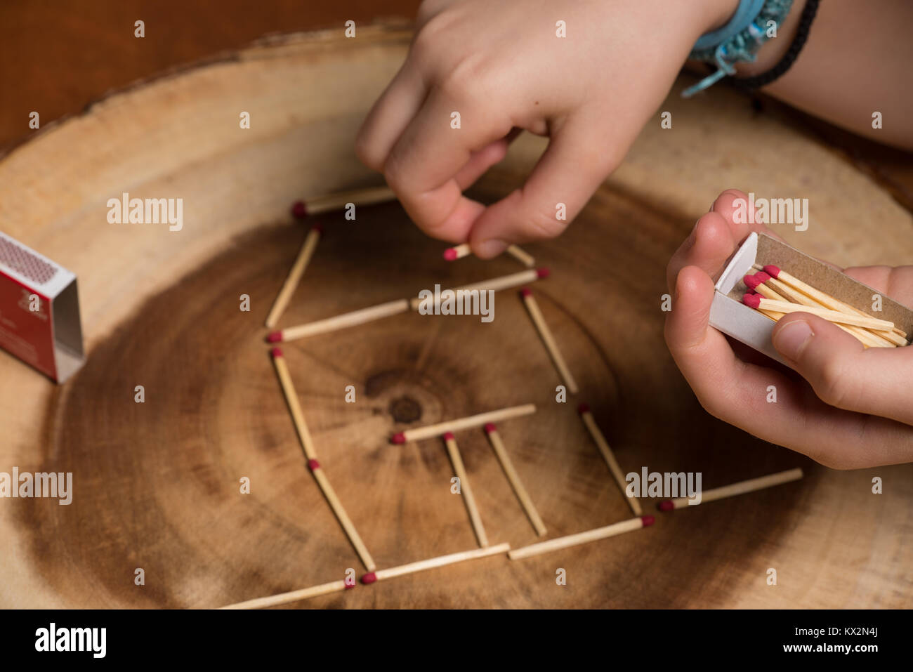 Child playing with matches Stock Photo - Alamy