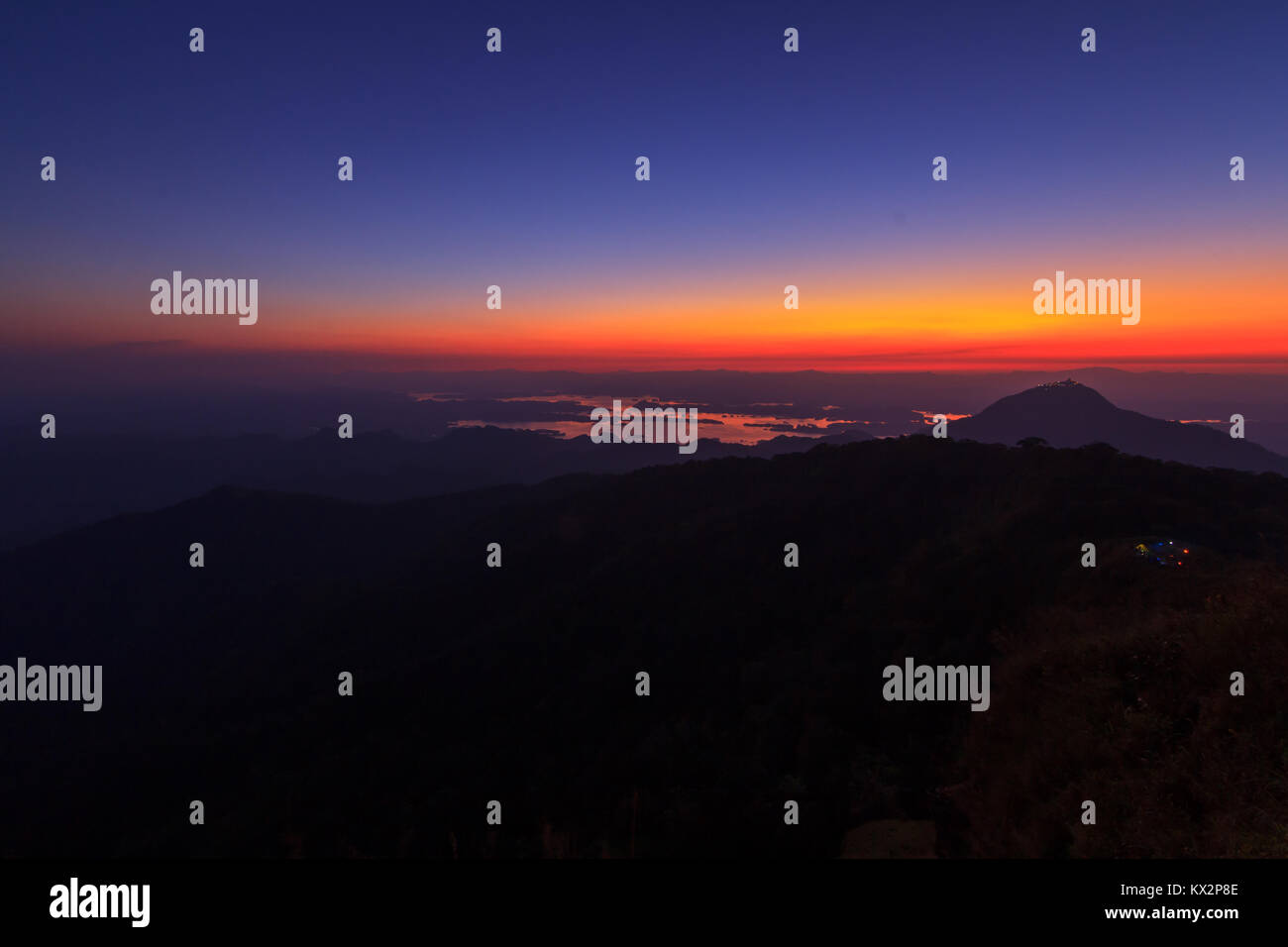 peak of high mountain in sunset time Stock Photo - Alamy