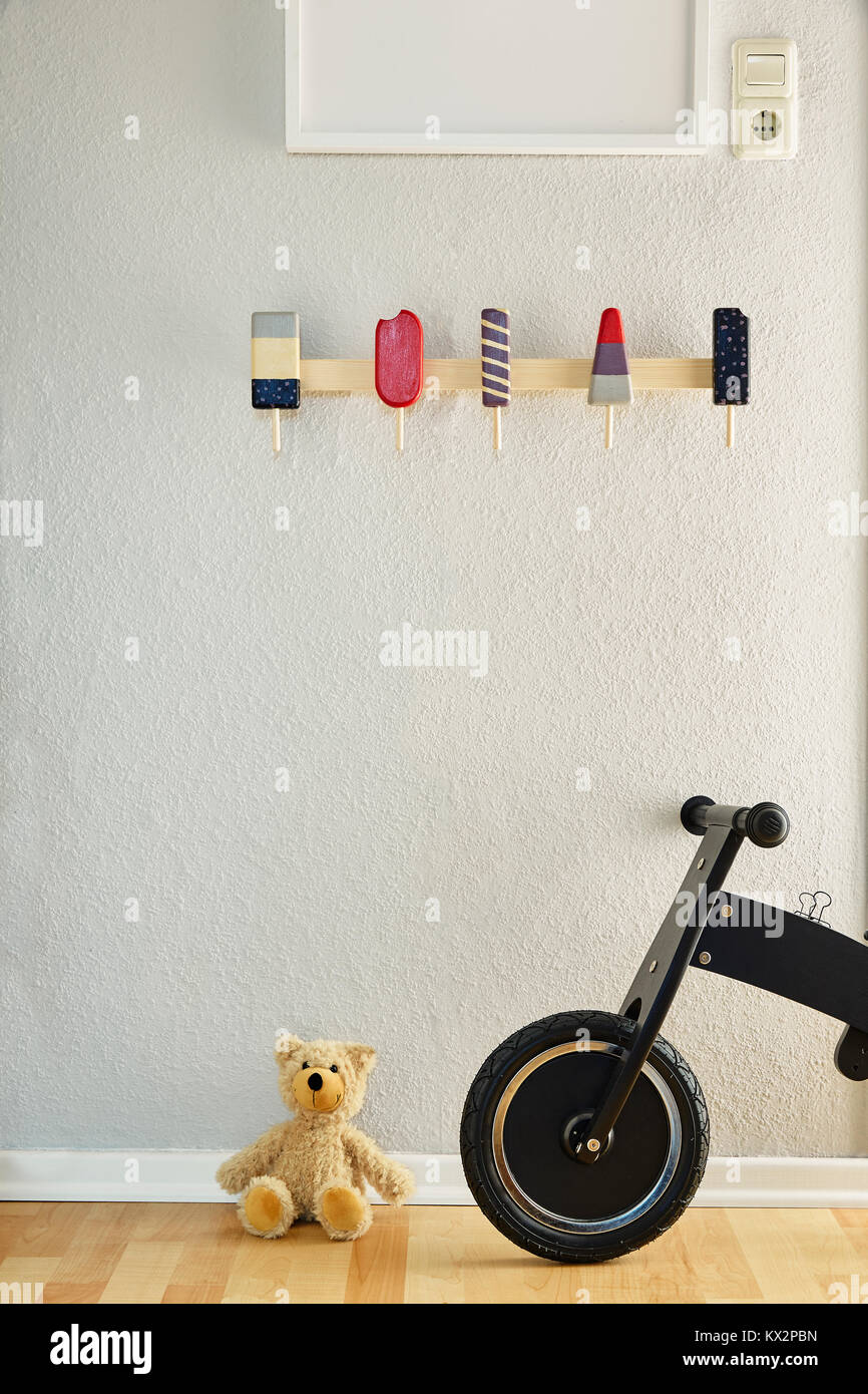 creative nursery popsicle wardrobe teddy bear and bike Stock Photo - Alamy