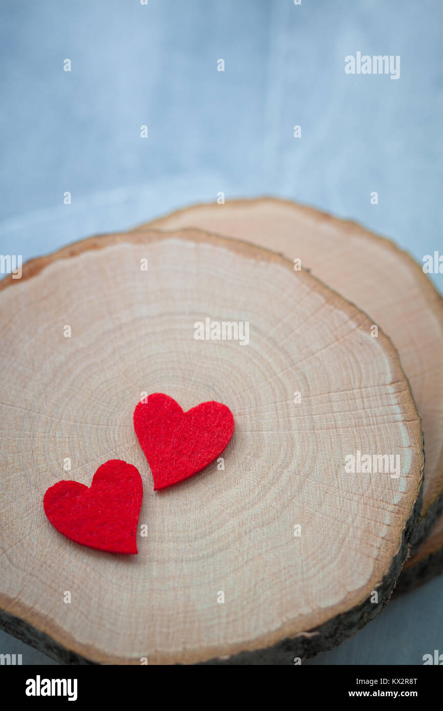 Two felted hearts on a wooden background, Valentine postcard concept ...