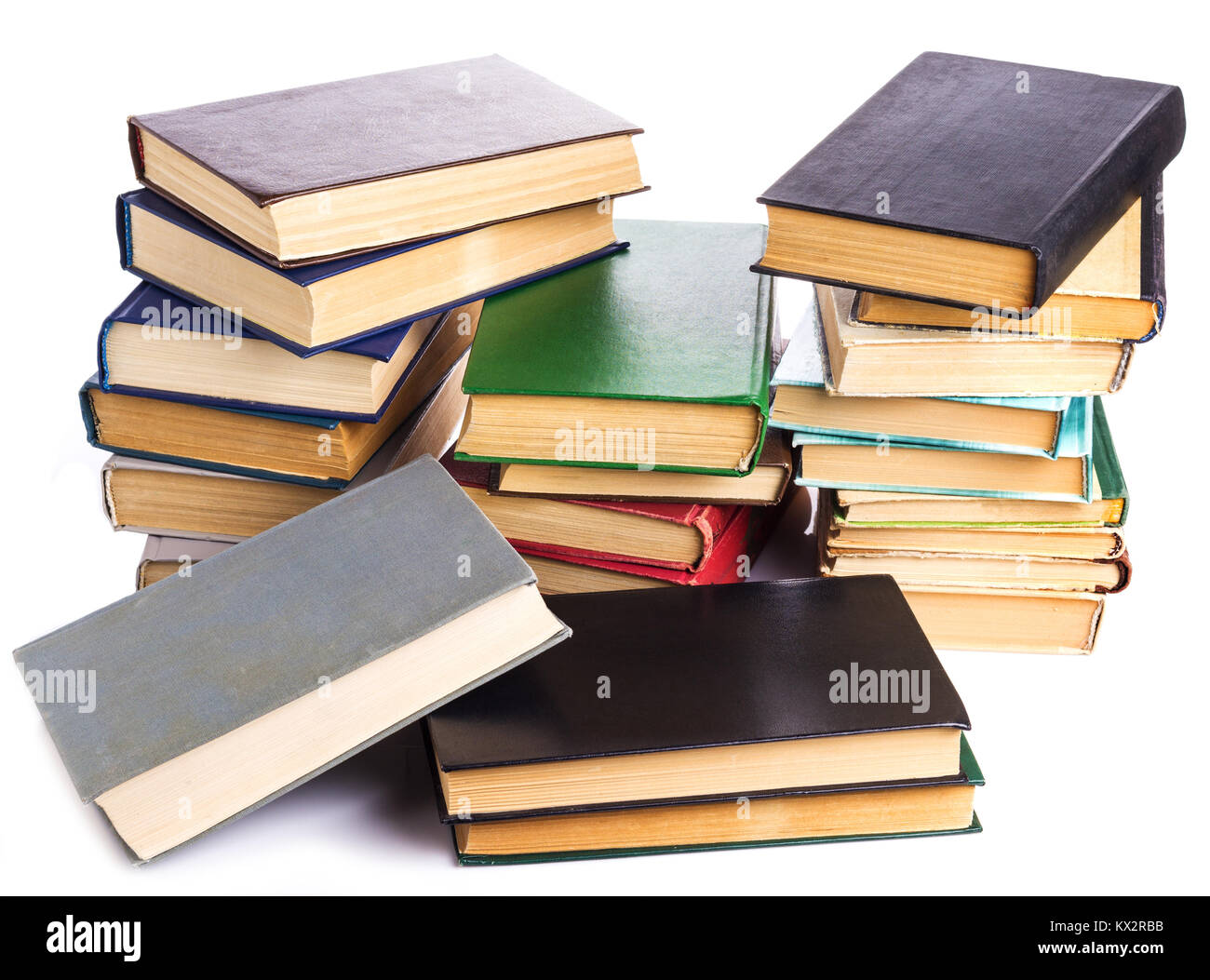 several piles of old books on white background Stock Photo - Alamy