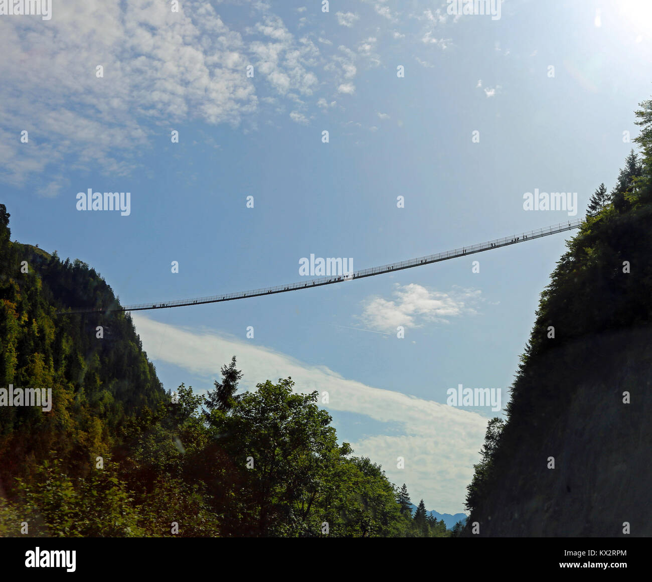 very long suspension bridge between two mountains with many adventurous ...