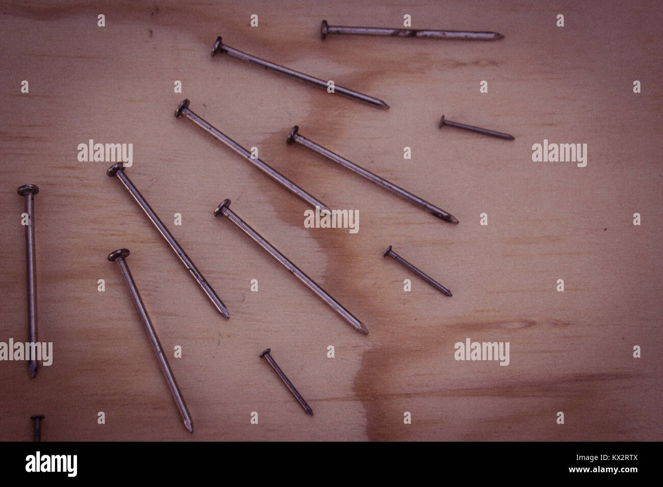 Photograph of some Metal nails in geometric composition Stock Photo - Alamy
