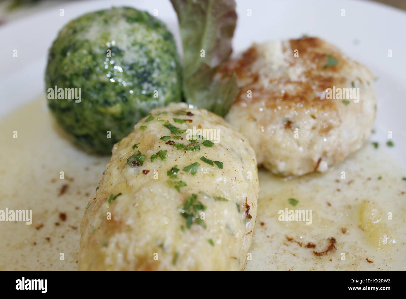 Tyrolean traditional dish, knodel or canederli with parsley Stock Photo ...
