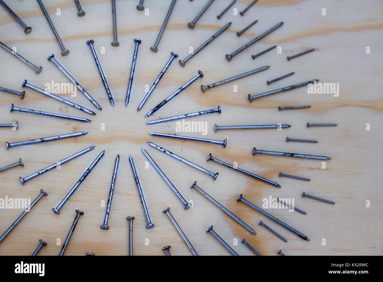 Photograph of some Metal nails in geometric composition Stock Photo - Alamy
