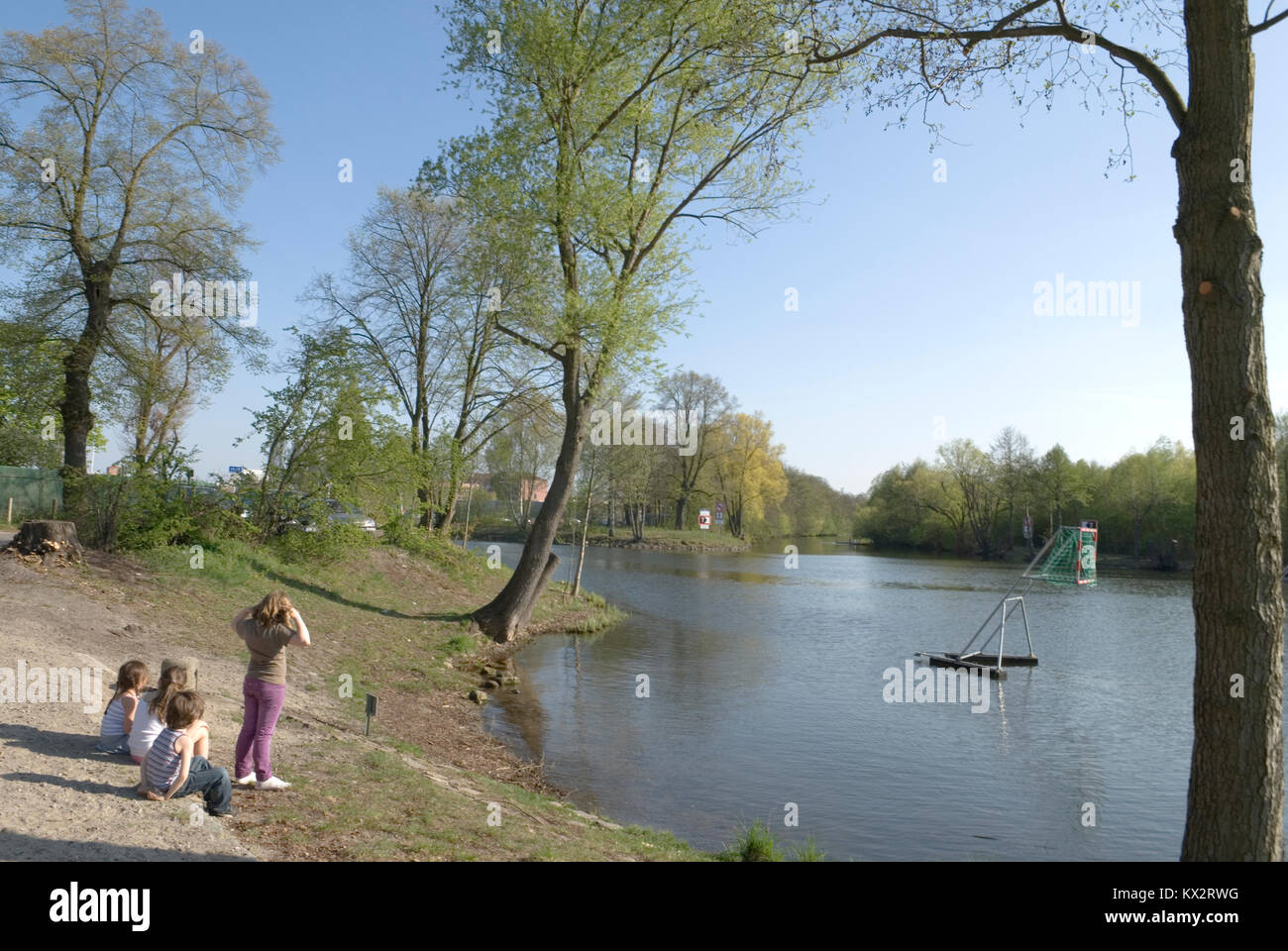 children are looking toward a lake Stock Photo - Alamy