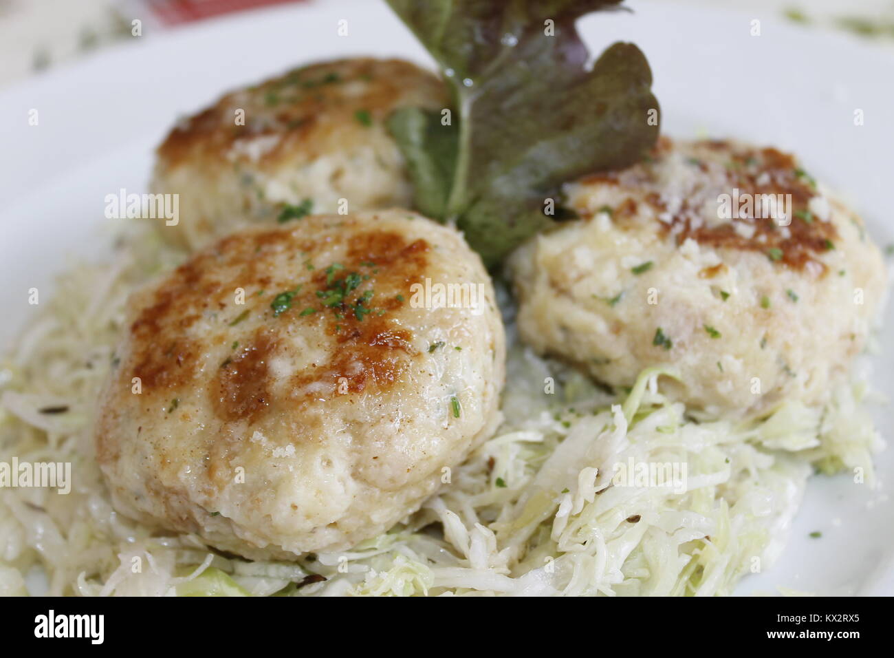 Tyrolean traditional dish, knodel or canederli with parsley Stock Photo ...