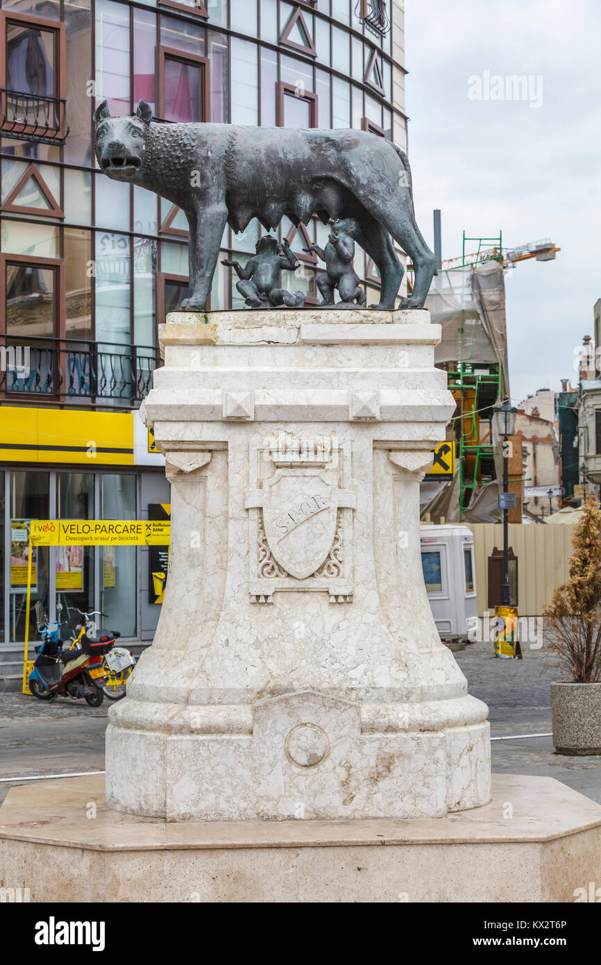 Statue of the she-wolf sucking Romulus and Remus in a run-down part of ...