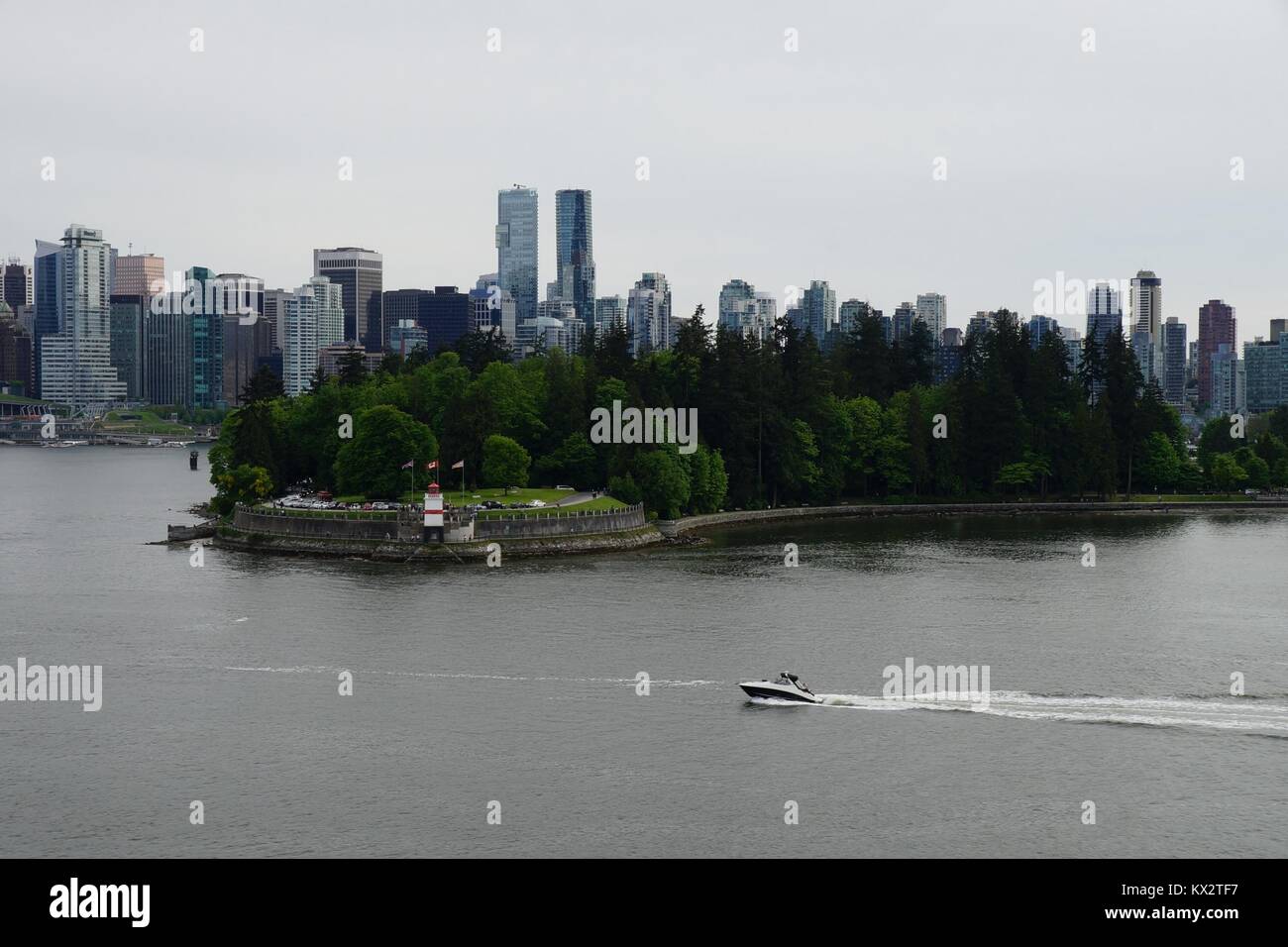 A view of Coal Harbor through Stanley Park and lighthouse, Vancouver ...