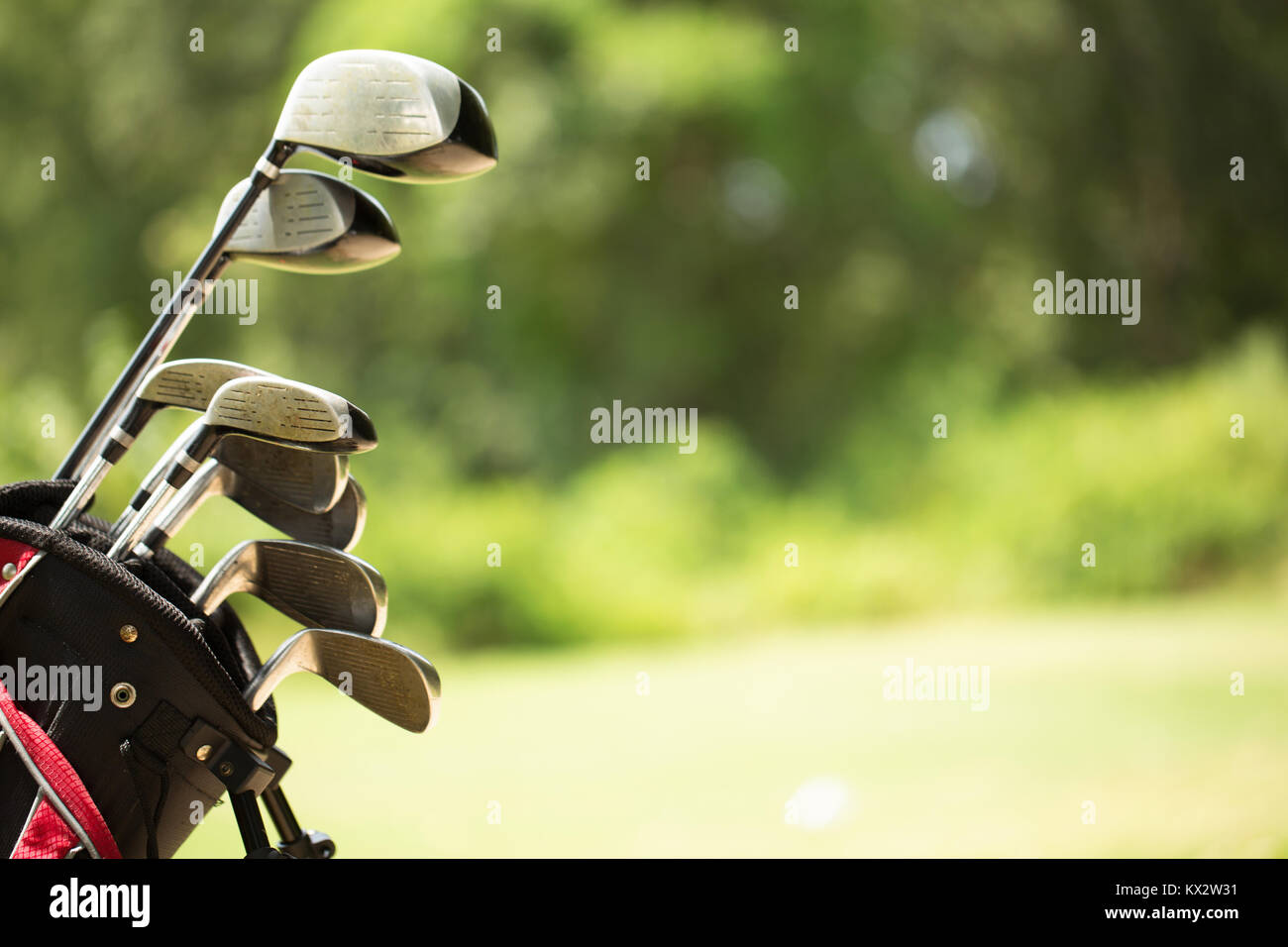 Portrait of glof culbs on a golf course Stock Photo - Alamy