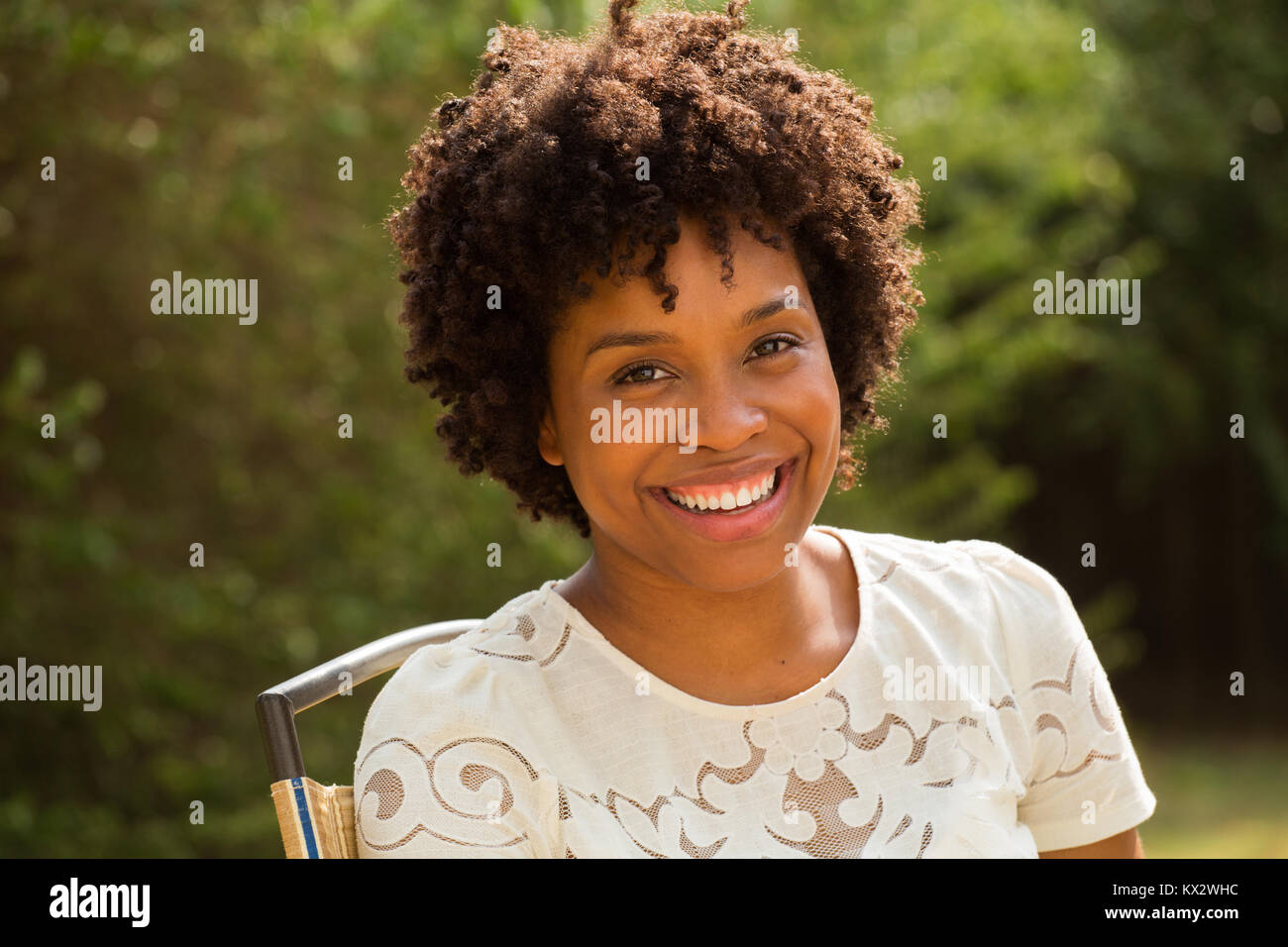 Young happy African American woman smiling Stock Photo - Alamy