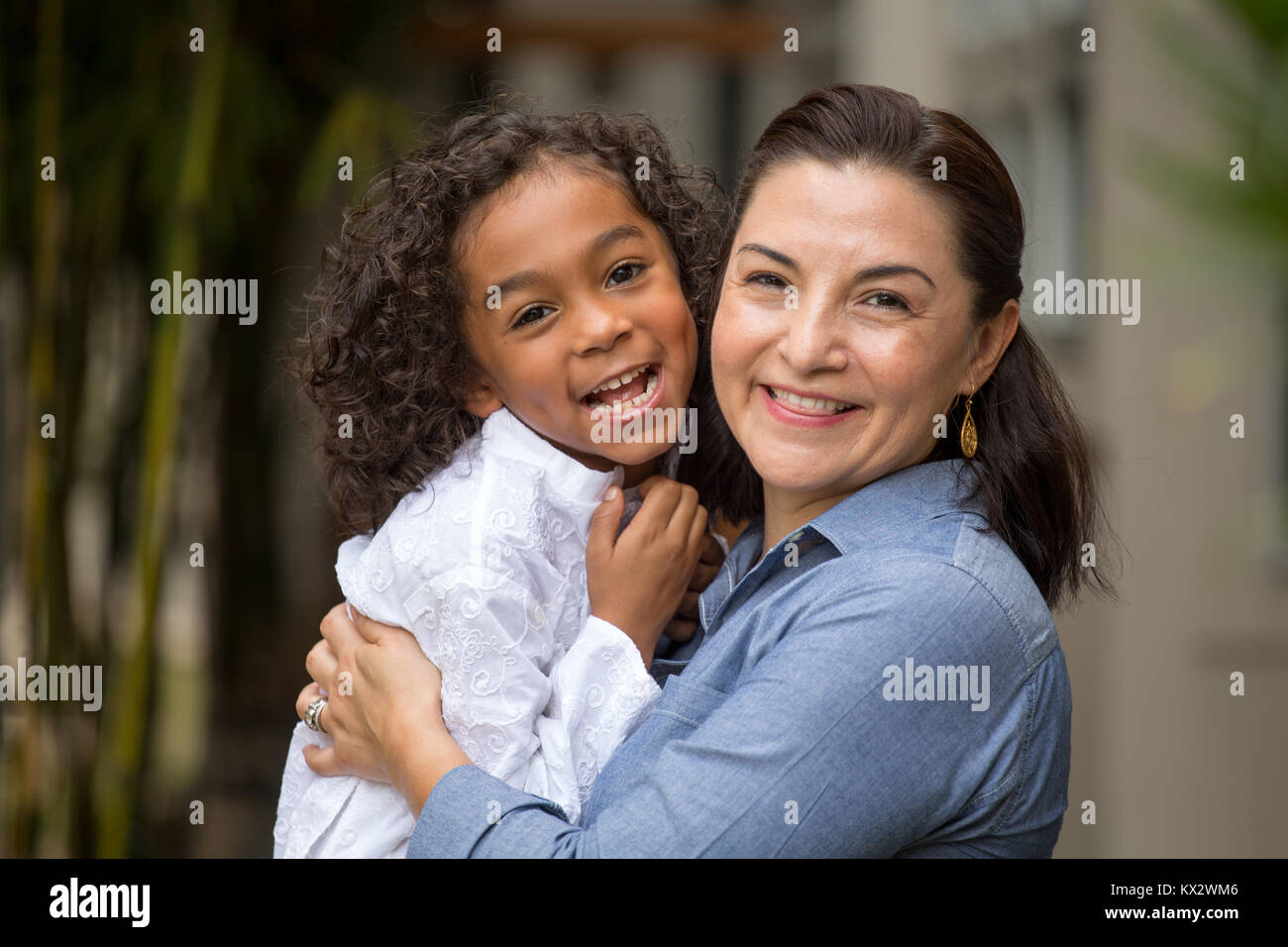 Hispanic mother and her daughter Stock Photo - Alamy