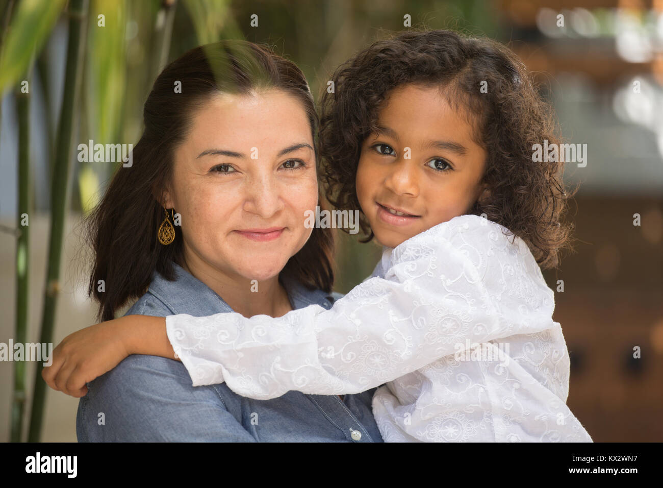 Hispanic mother and her daughter Stock Photo - Alamy