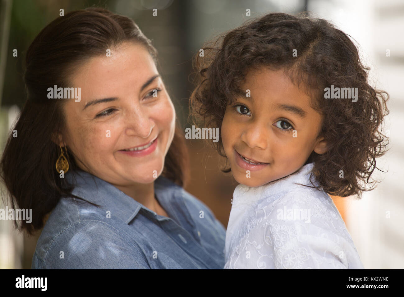 Hispanic mother and her daughter Stock Photo - Alamy