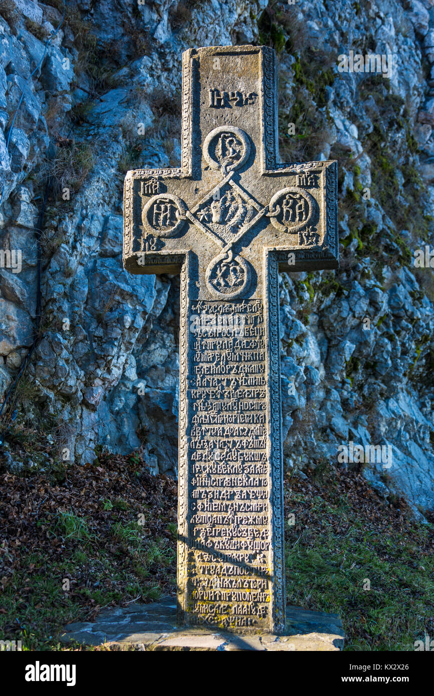 Bran, Romania - November 19, 2016: Medieval stone cross with religious ...