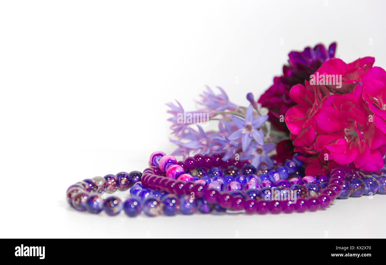 feminine and romantic pearls and flowers in violet tone Stock Photo - Alamy