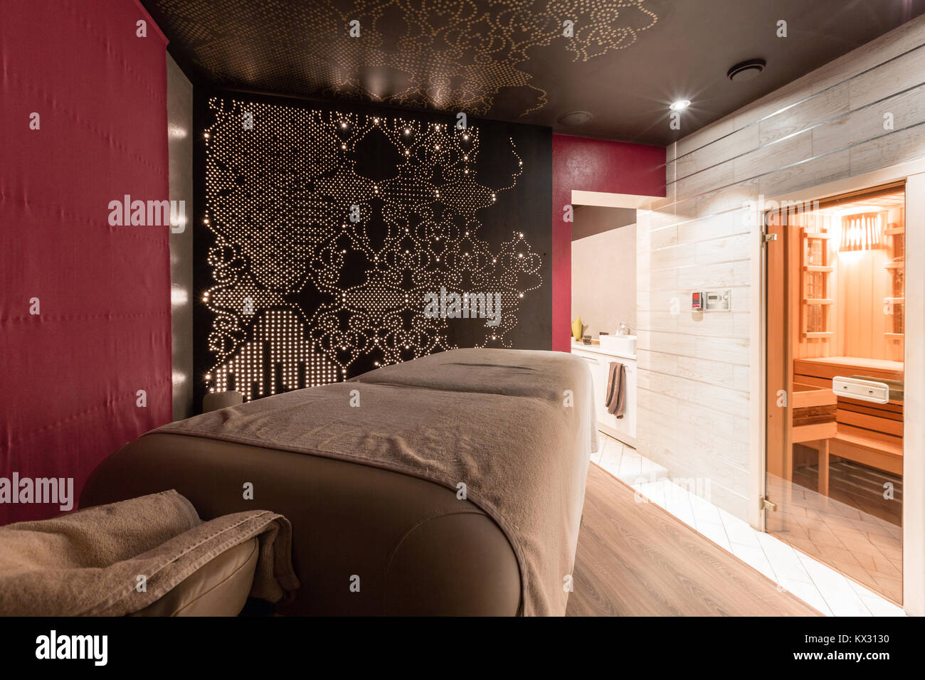 Massage room interior design in wellness and spa center. Dim lighting ...