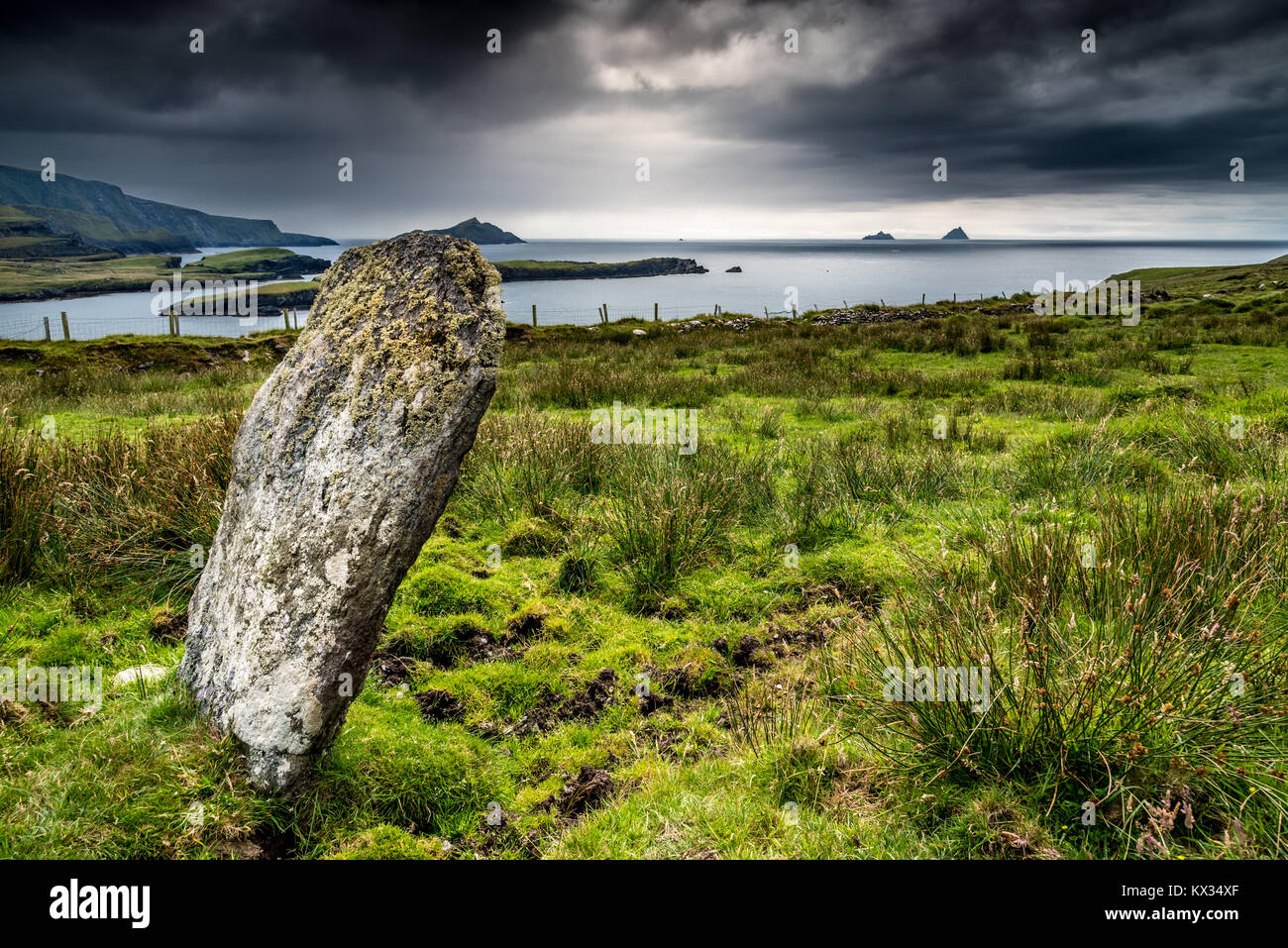 A standing stone on the coast of Valentia Island faces the Skellig ...