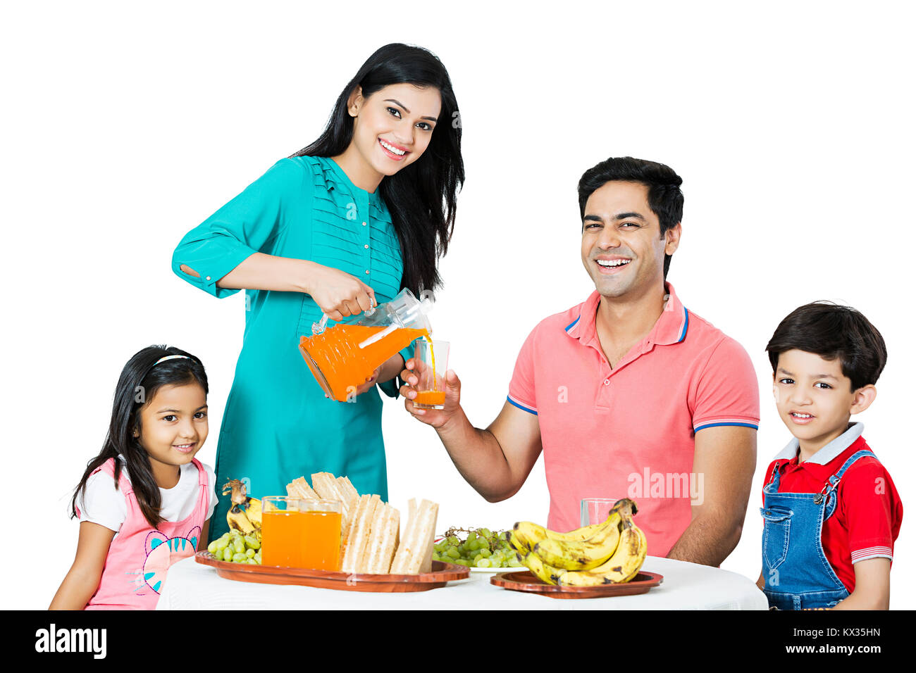Family With kids Mother Serving Juice Morning Breakfast Stock Photo - Alamy