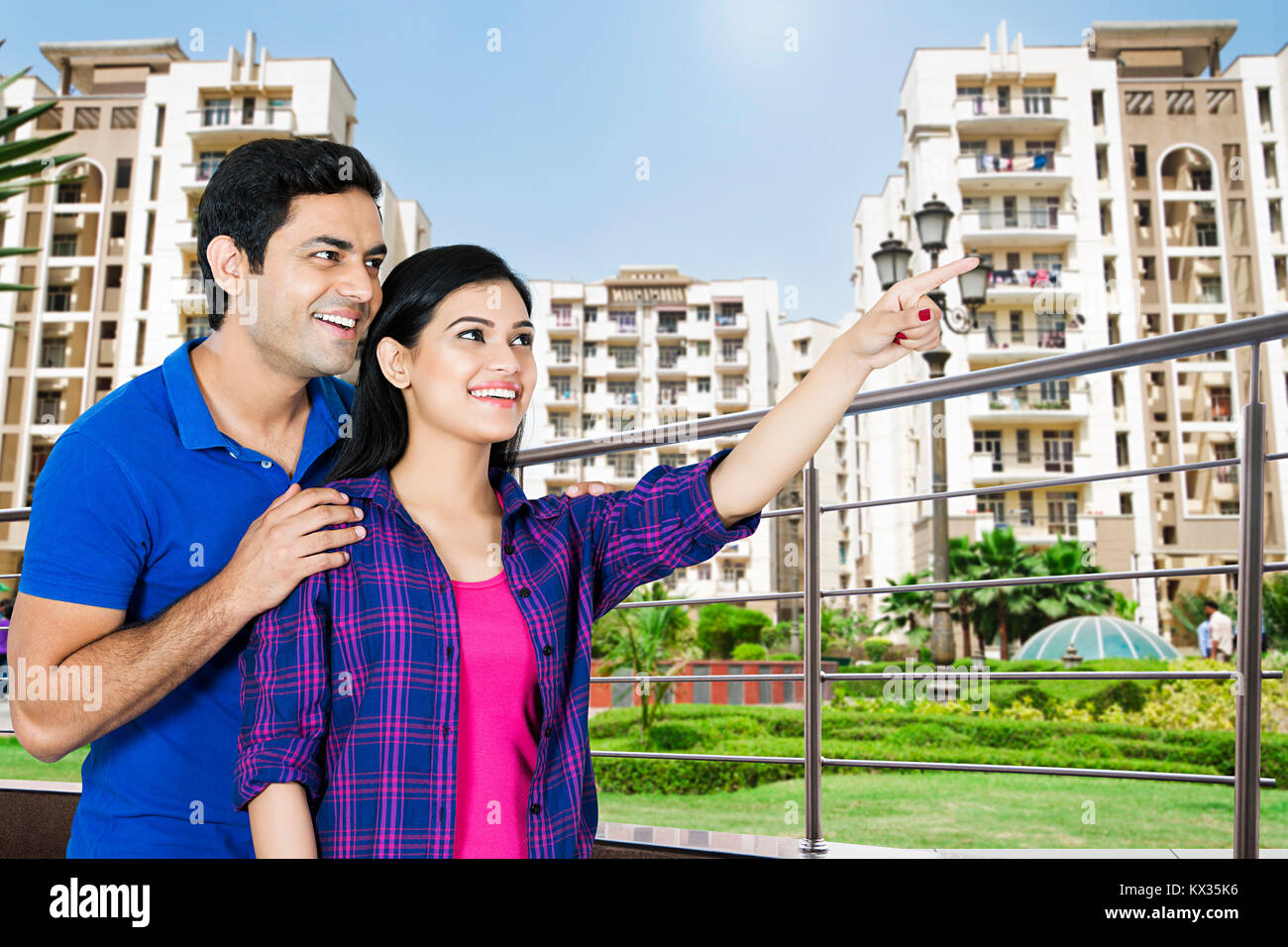 Happy Married Couple Pointing Finger Showing Watching Balcony Apartment ...