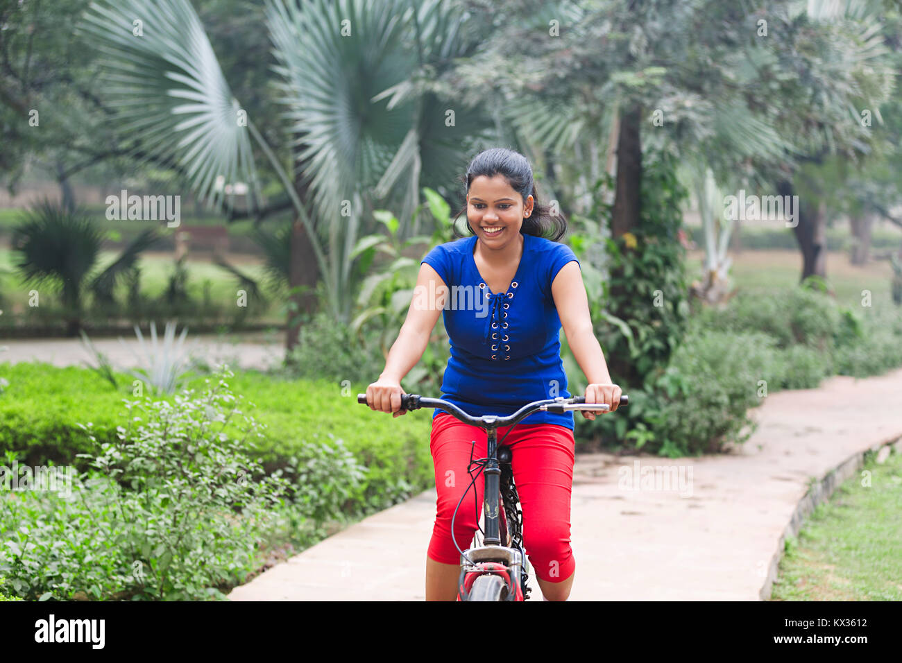 Young Woman Riding Cycle Walkway Park Stock Photo - Alamy
