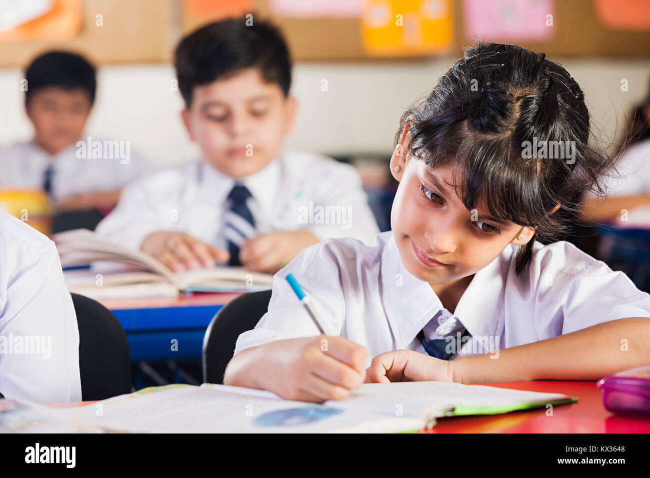 Indian girl writing hi-res stock photography and images - Alamy