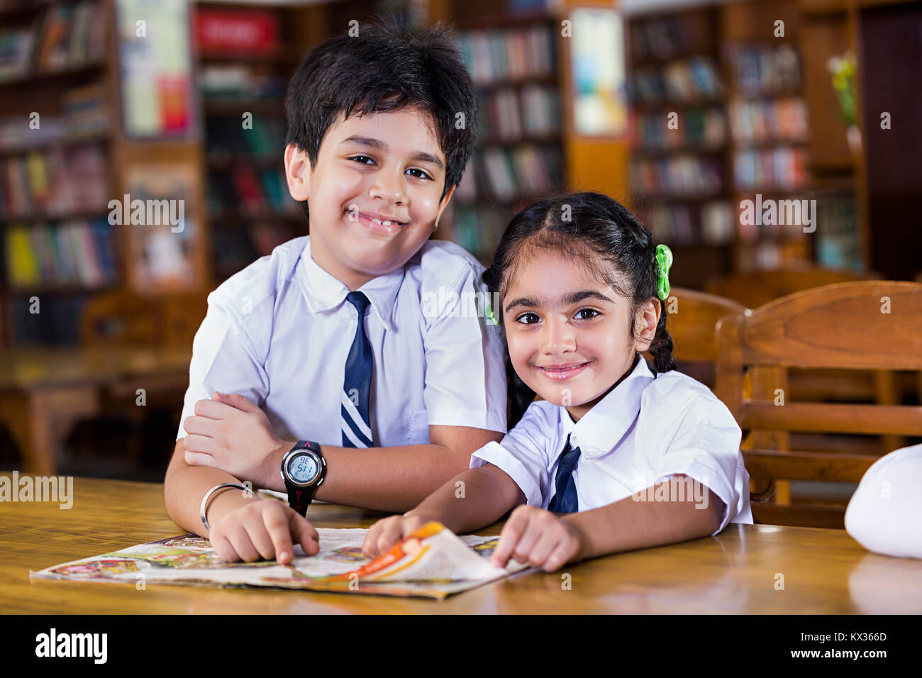 Kids studying in library hi-res stock photography and images - Alamy