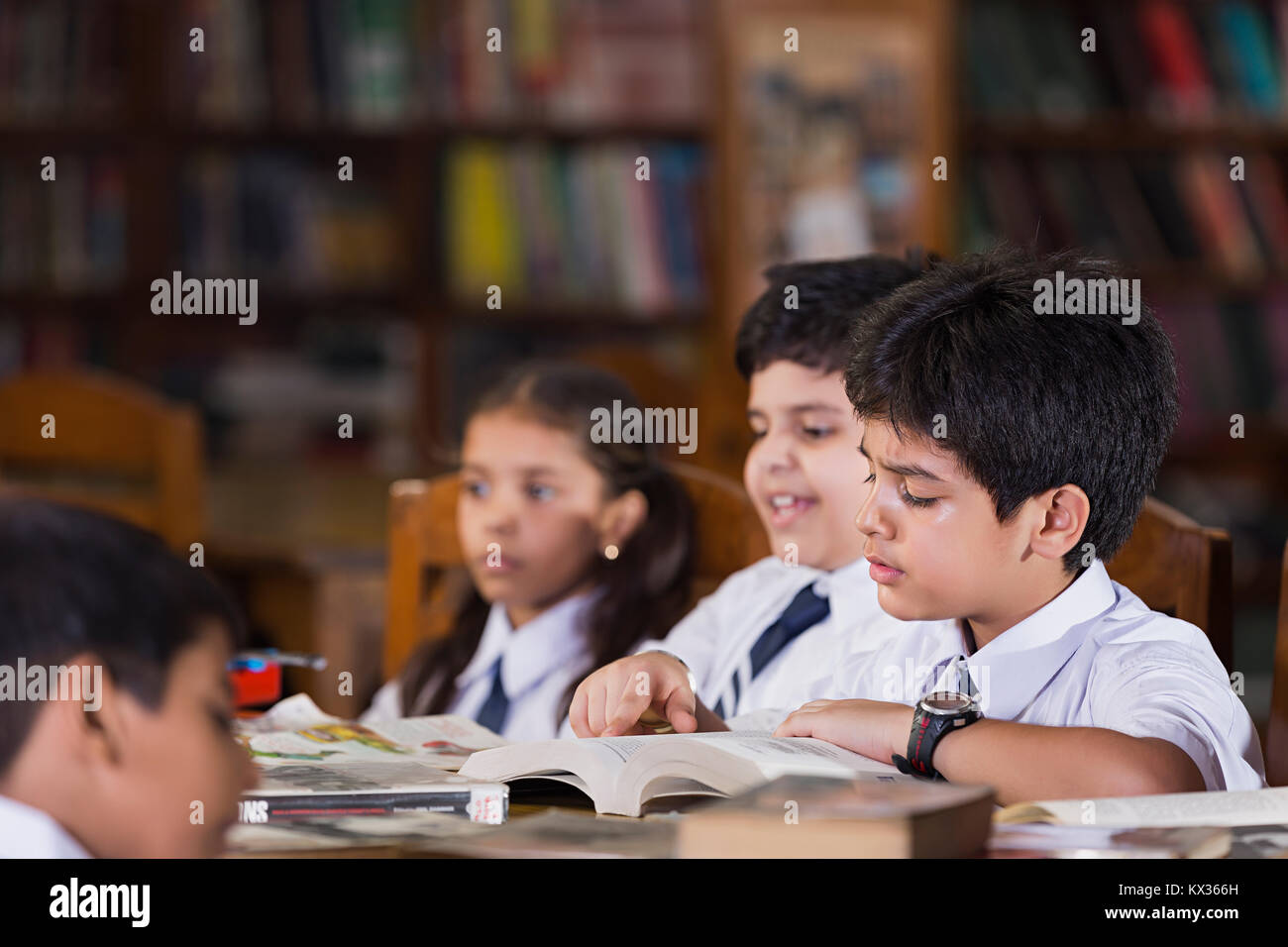 Indian School Children Students Reading Book Studying In Library Stock ...