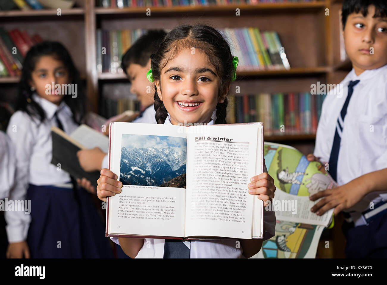 Happy 1 Indian School Little Girl Student Showing Book In Library Stock ...