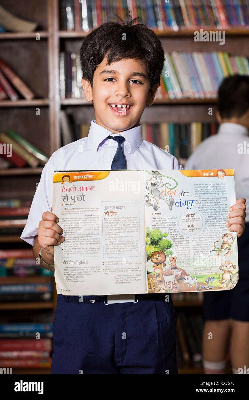 1 Indian School Kid Boy Student Showing Book In Library Smiling Stock ...