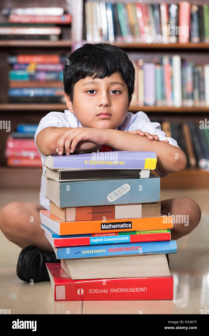 Boy school uniform sitting on floor hi-res stock photography and images ...