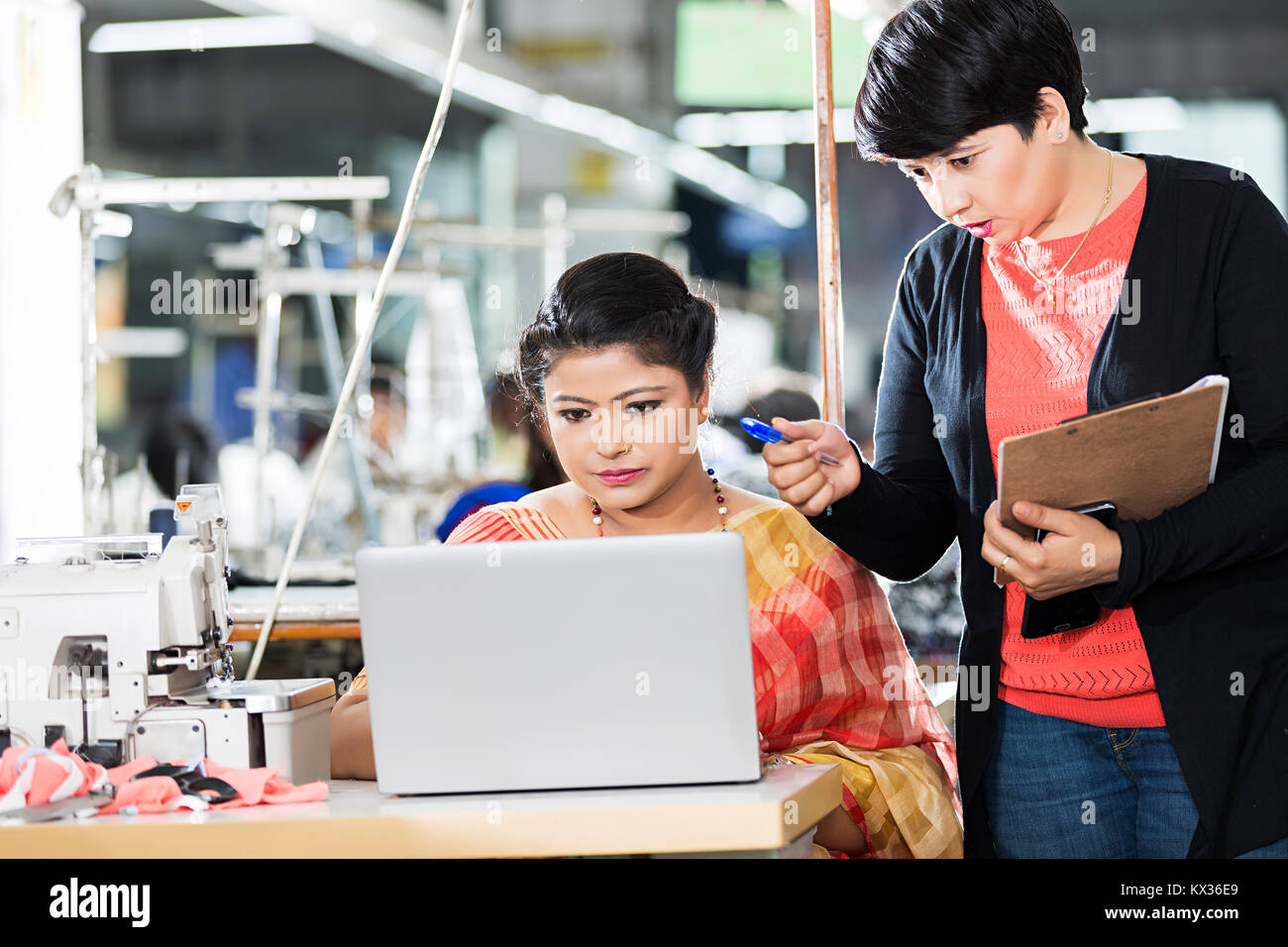 Worker Tailor and Manager Laptop Working In Garment Workshop Stock ...