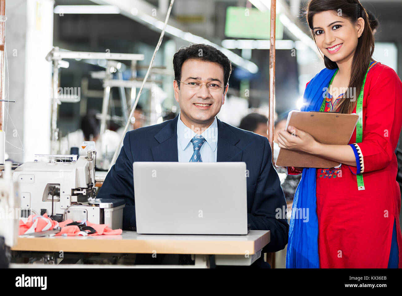 2 People Employee Tailor and Manager Laptop Working In Garment-Factory ...