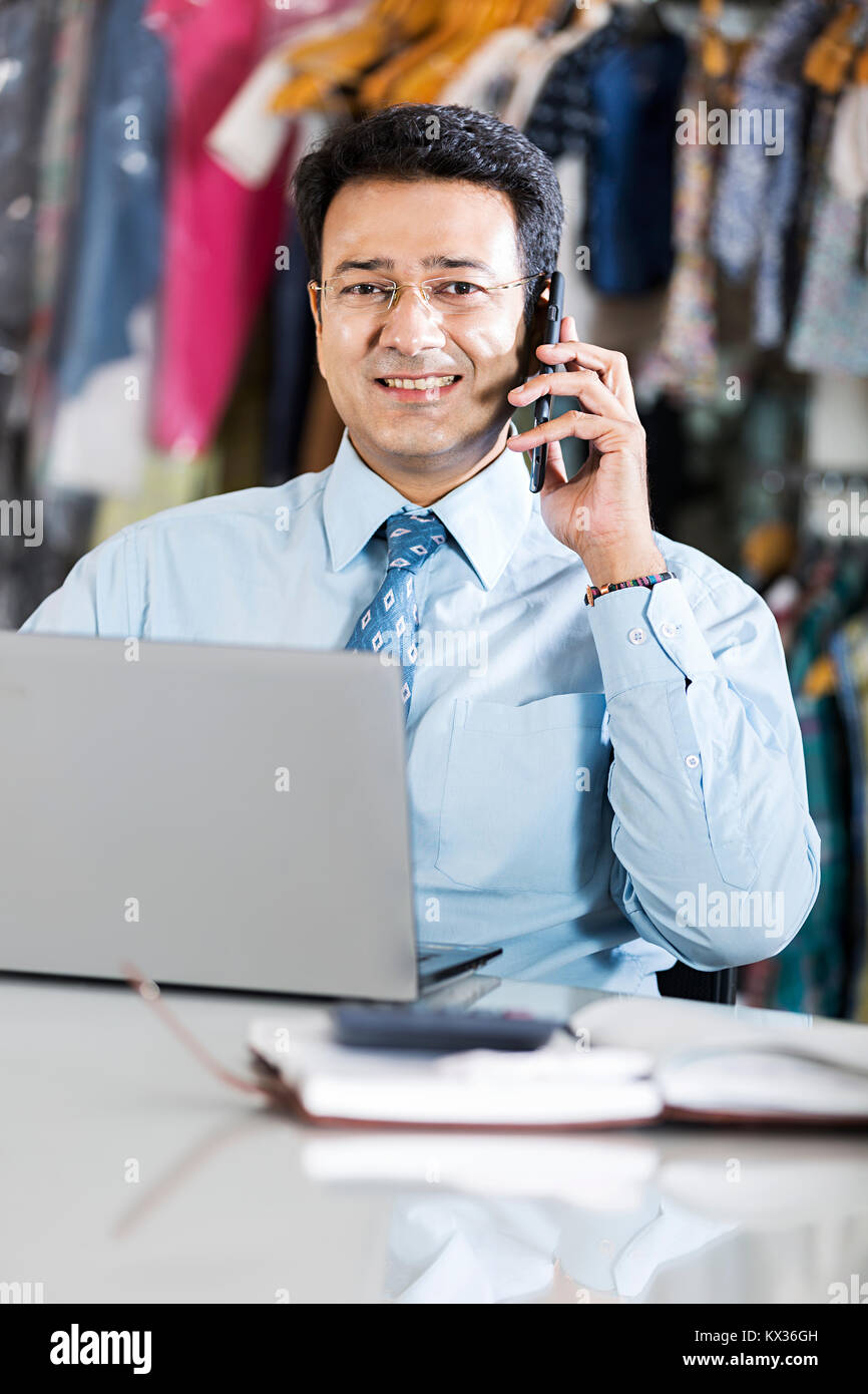 1 Businessman Manager laptop Working And Talking Mobile-phone Boutique ...