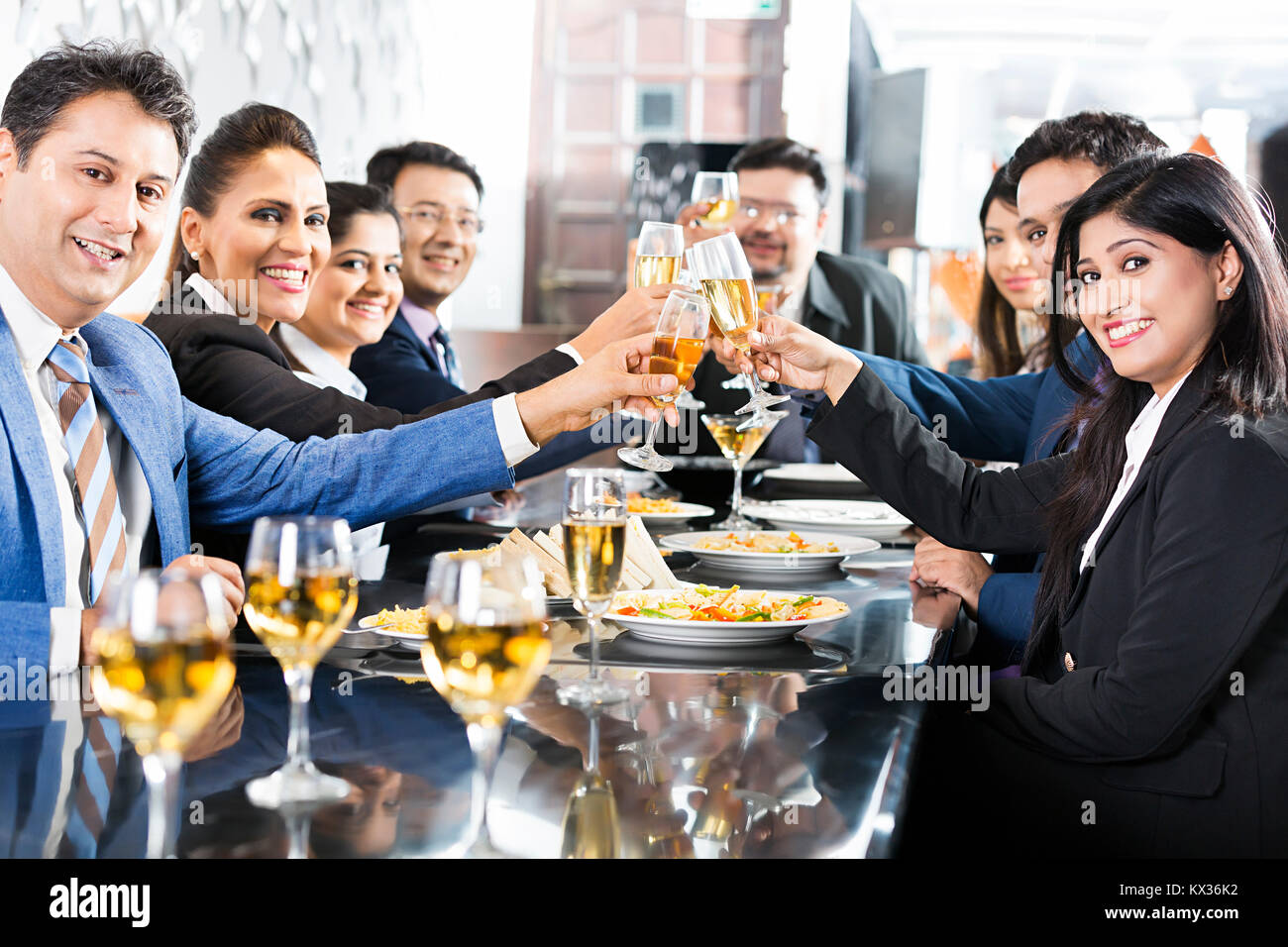 Employees and their partners enjoying eating dinner at the annual ...