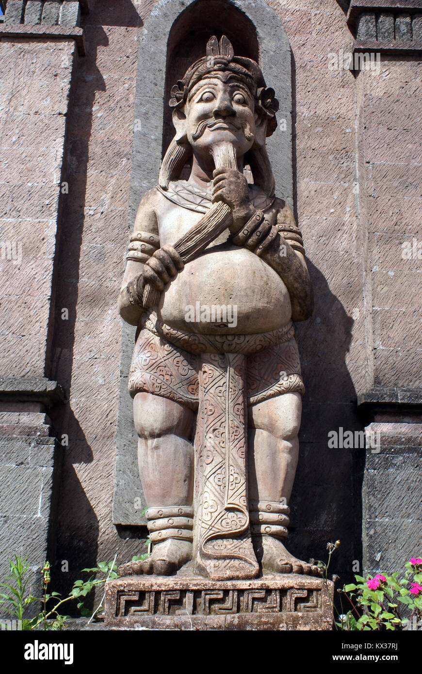 Stone man with long beard near entrance of temple, bali Stock Photo - Alamy