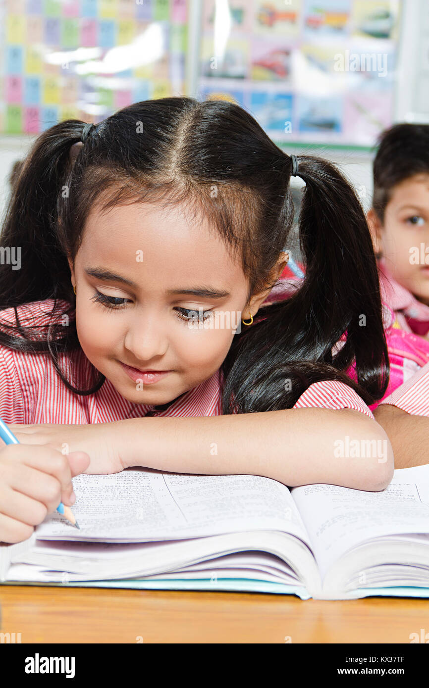 1 Indian School Kid Girl Student Writing Notebook Studying Classroom ...