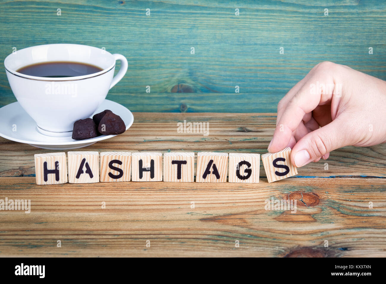 hashtags. Wooden letters on the office desk, informative and ...