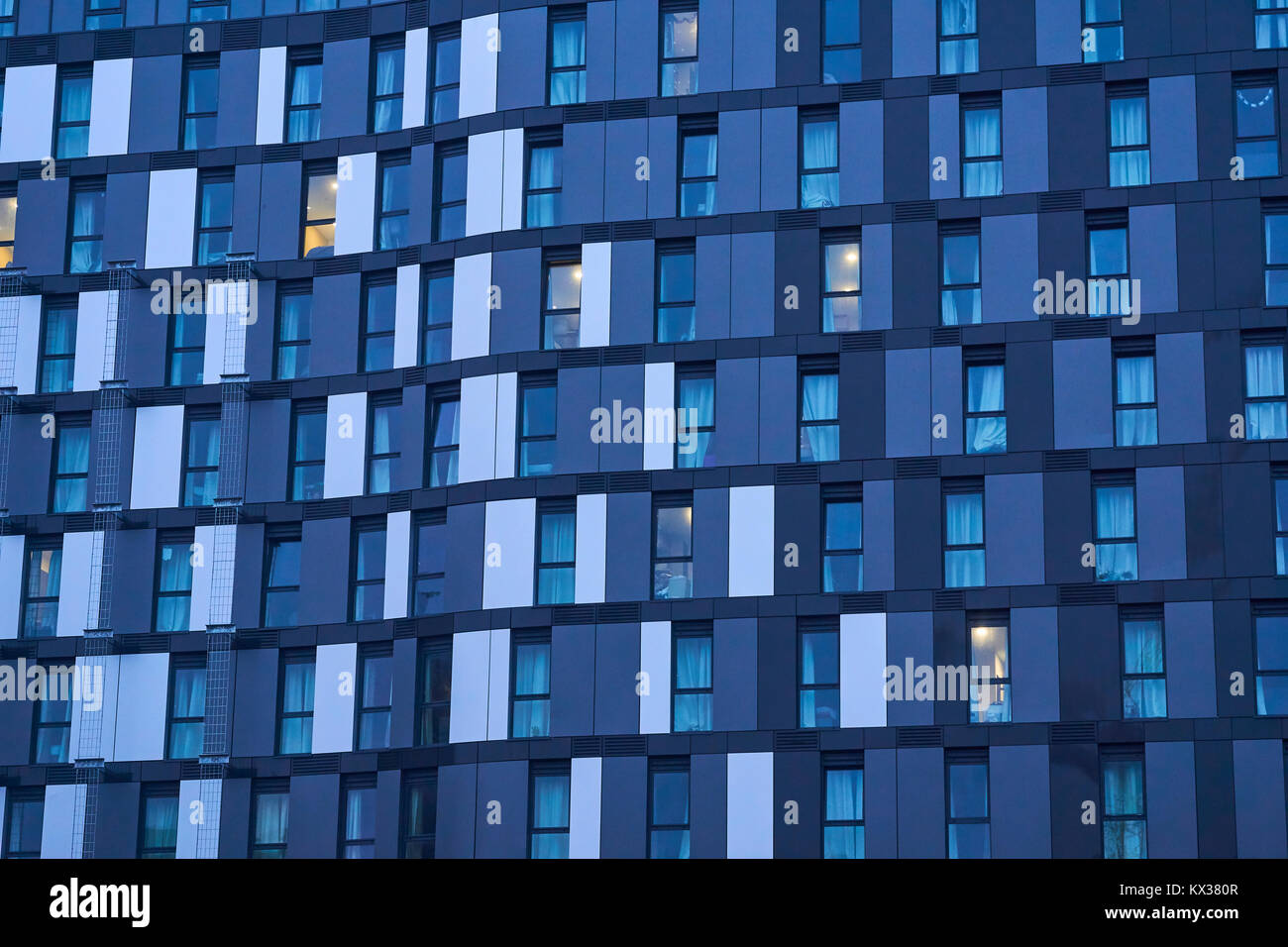 amazing close up shot of apartment building showing blue windows with a ...