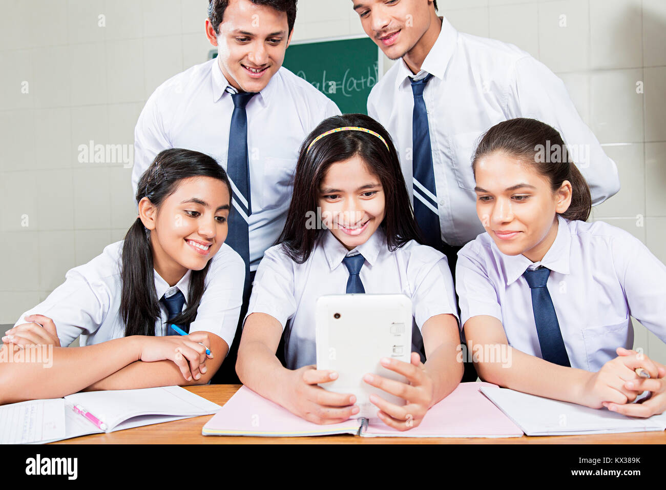 Group Indian School Students Classmate Reading Messaging Tablet Pc ...
