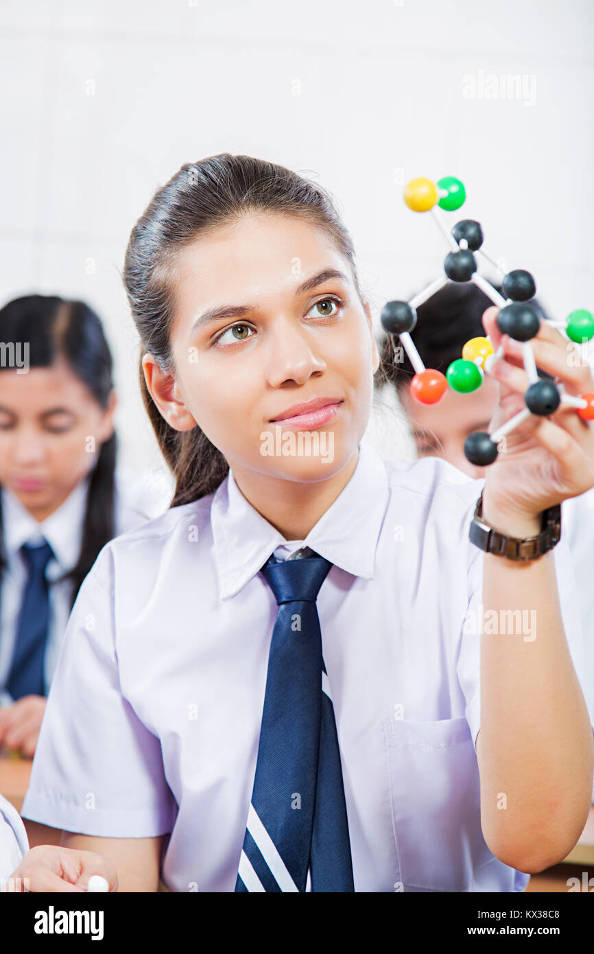 1 Indian school girl experimenting molecule model in Science laboratory ...