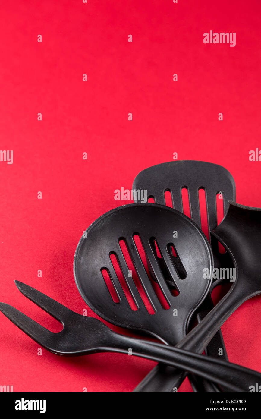 Used home kitchenware with scratches on paper background. Modern black ...