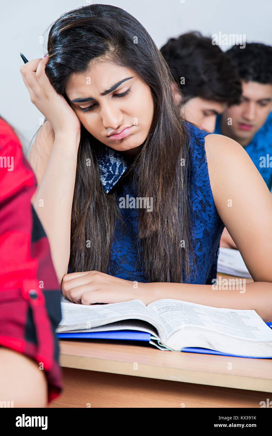 Indian Young Girl Student Reading Book Studying Stress In Classroom ...