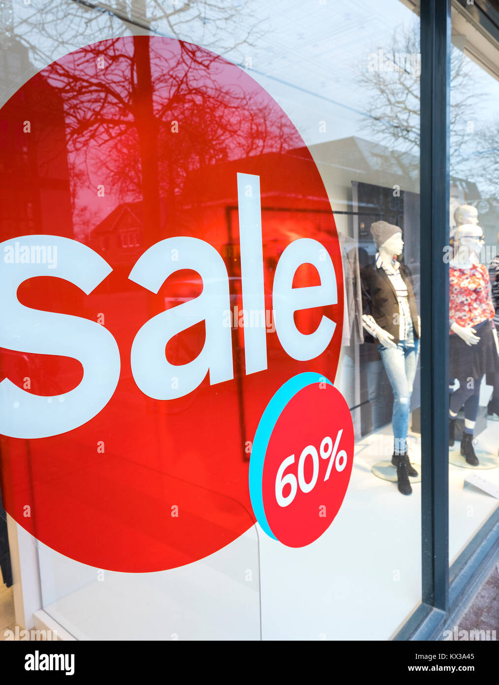 the word sale oin colorful display in shopping window during winter ...