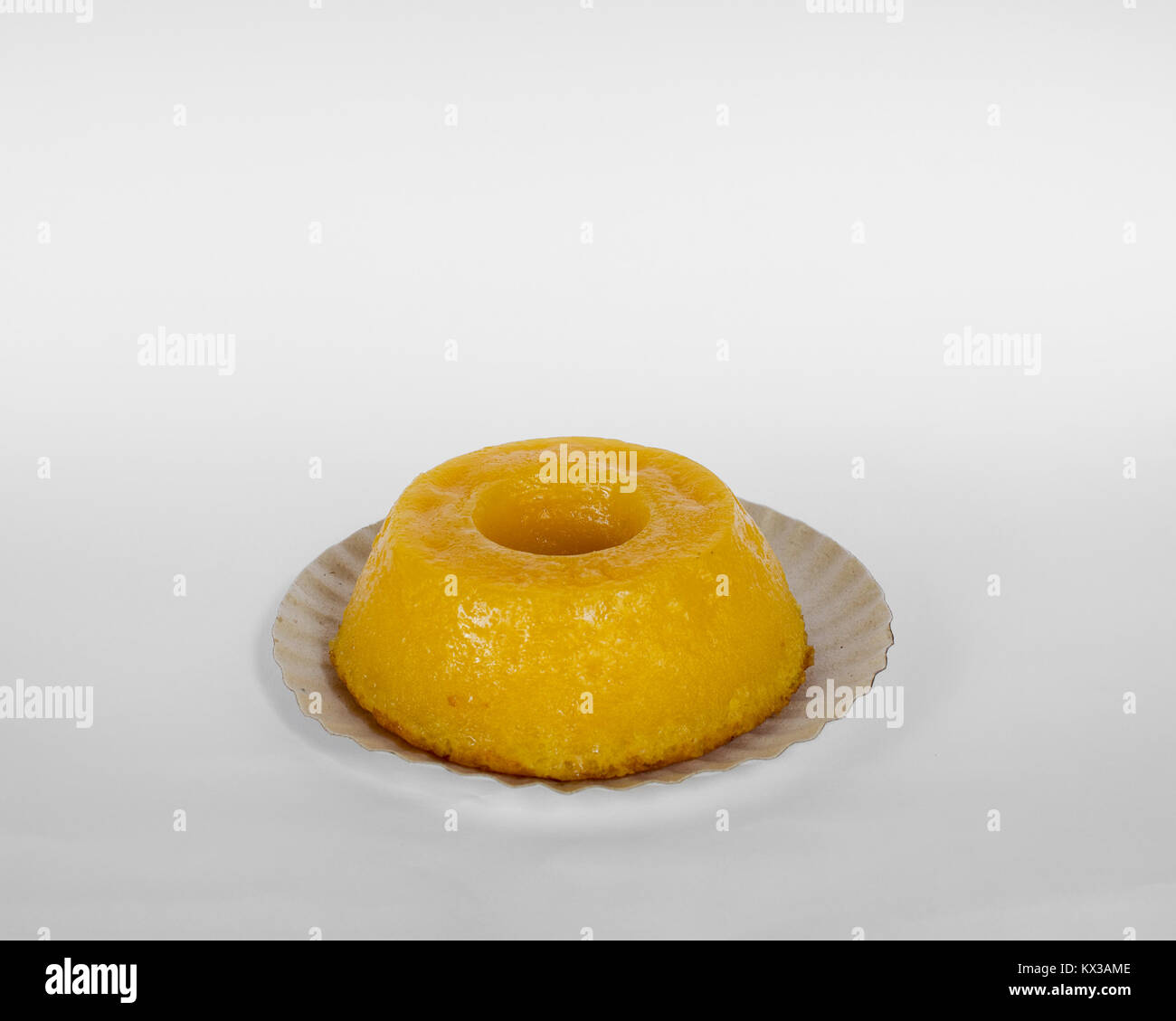 Quindim, a tasty yellow Brazilian dessert made with condensed milk and ...