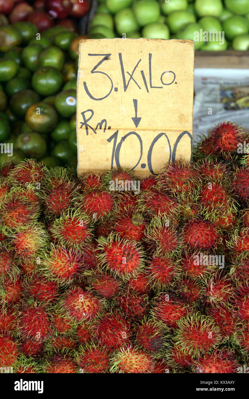 Rambutan and apples on the table, market, Malaysia Stock Photo - Alamy