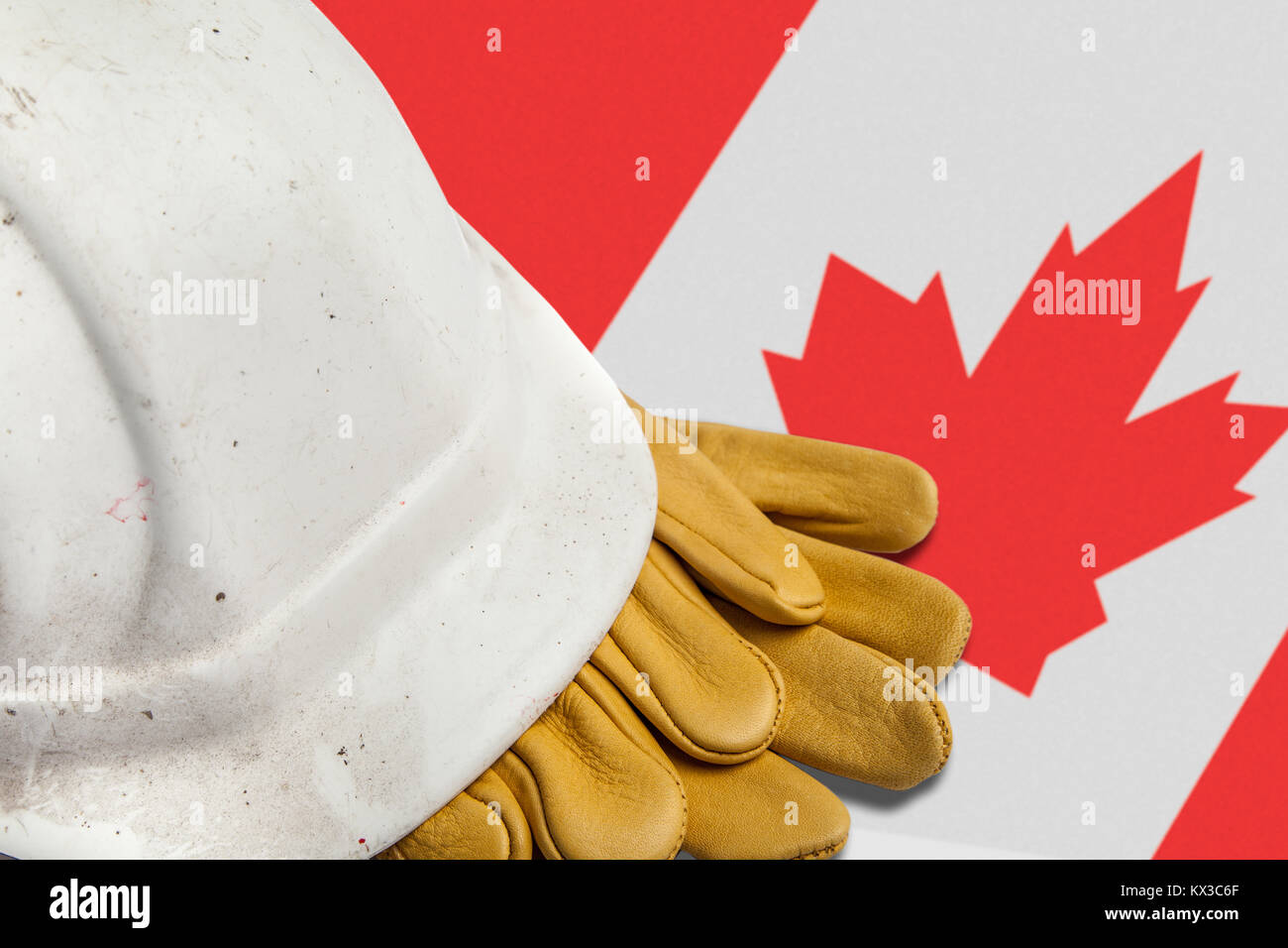 Construction Workers Hard Hat and Gloves on flag of Canada Stock Photo ...