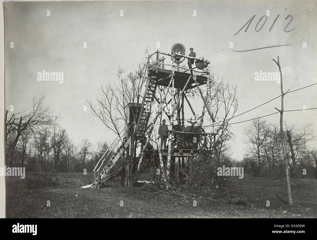 The image depicts a German searchlight at a high elevation, used for ...