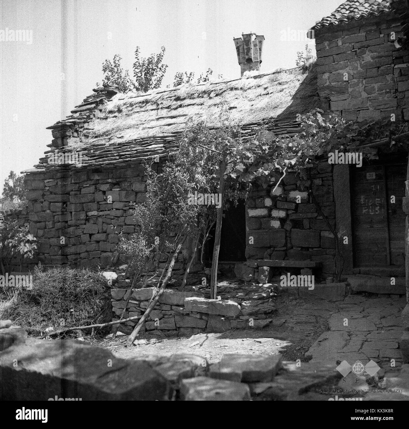 The image shows a Škrljevc stable covered with straw, originally used ...